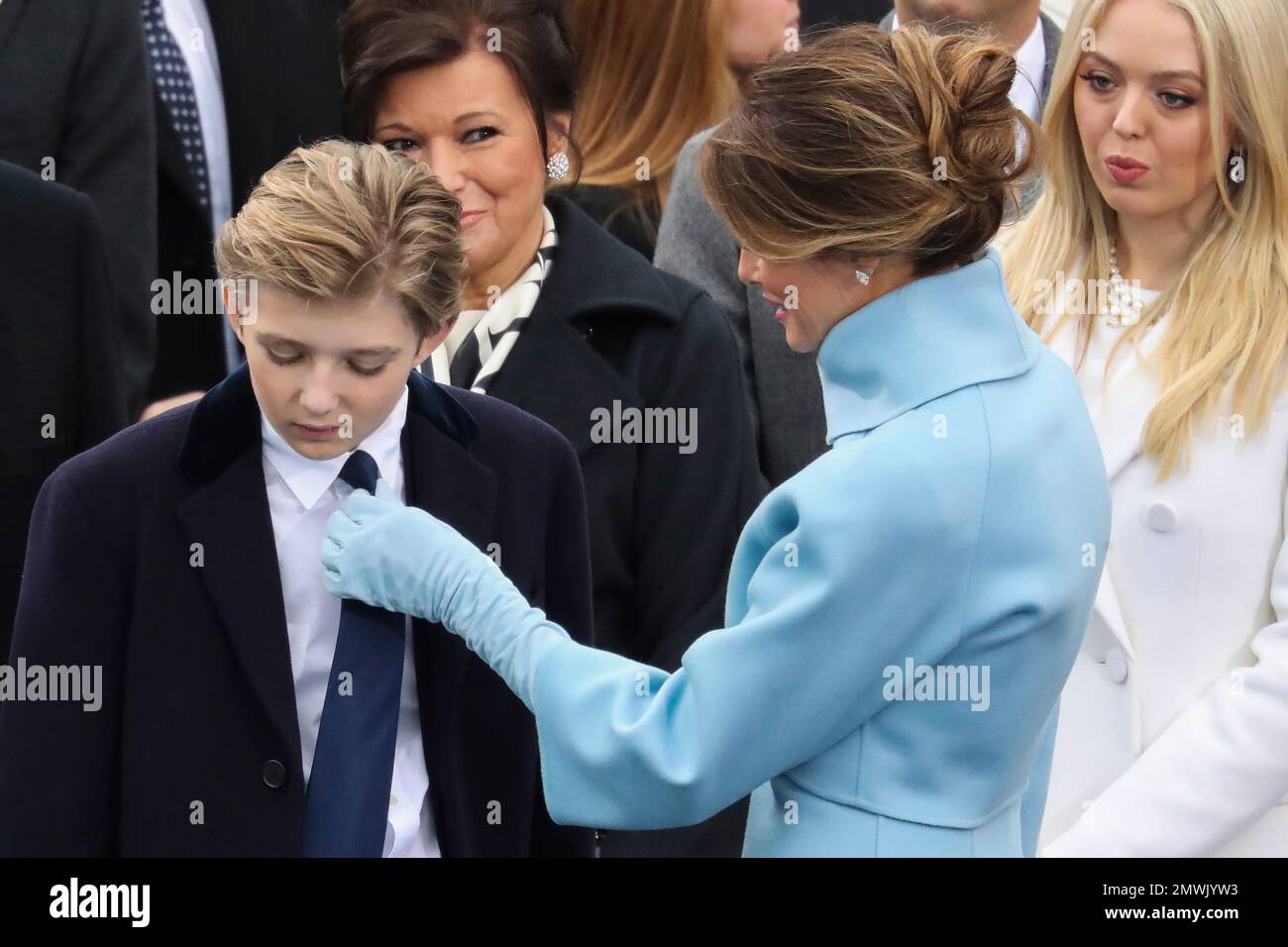 President Donald Trump's wife Melania Trump adjusts their son Barron's ...