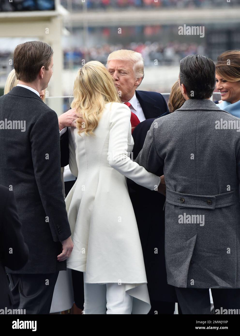 US President Donald Trump kisses his daughter Ivanka after being sworn ...