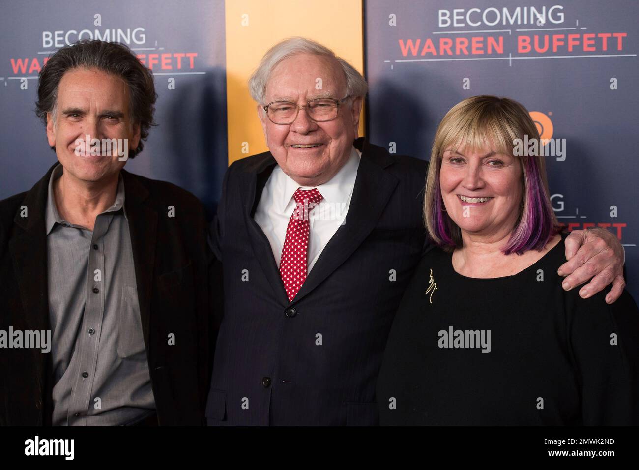 Peter Buffett, left, Warren Buffett and Susie Buffett attend the world ...