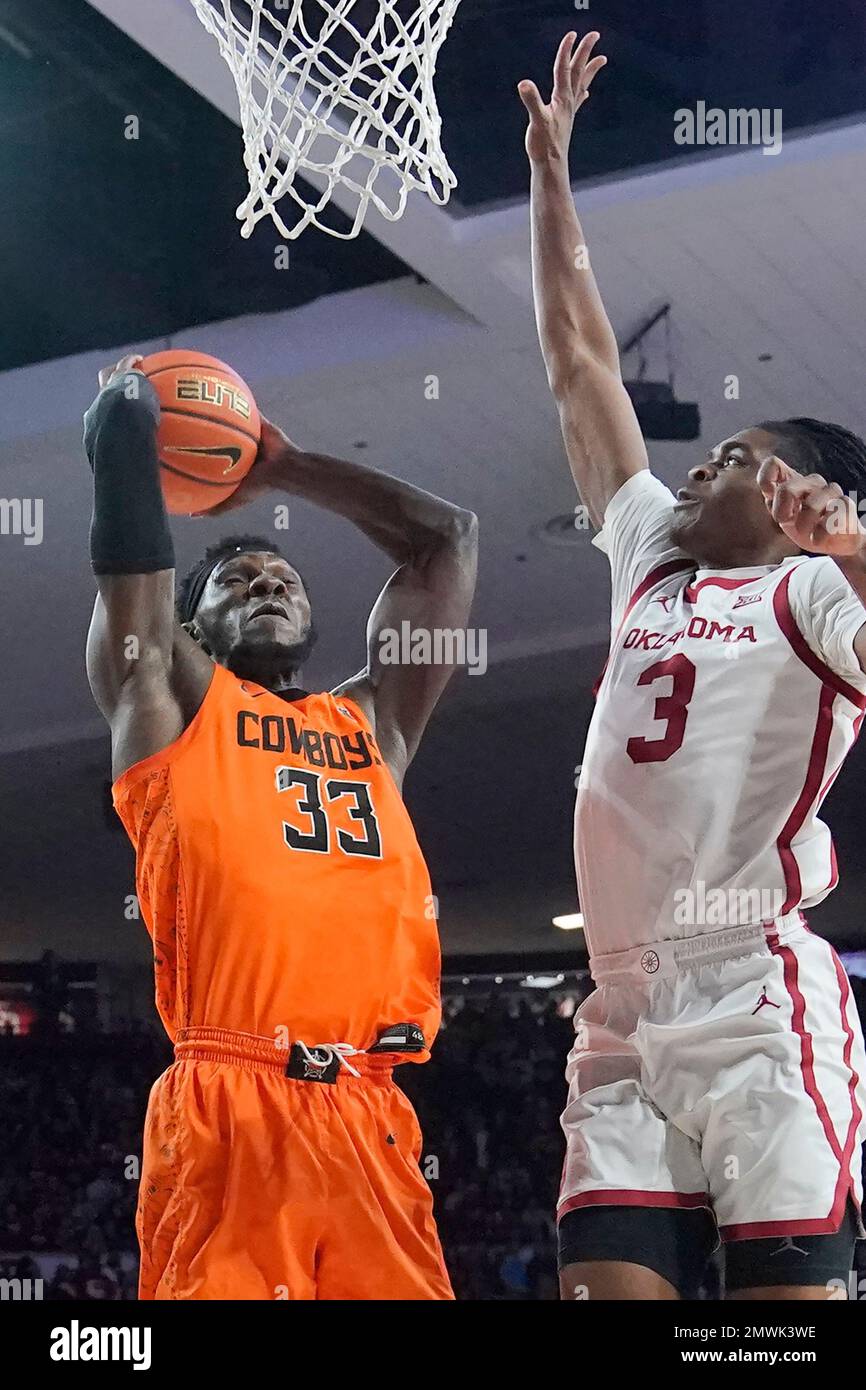 Oklahoma State forward Moussa Cisse (33) shoots in front of Oklahoma ...