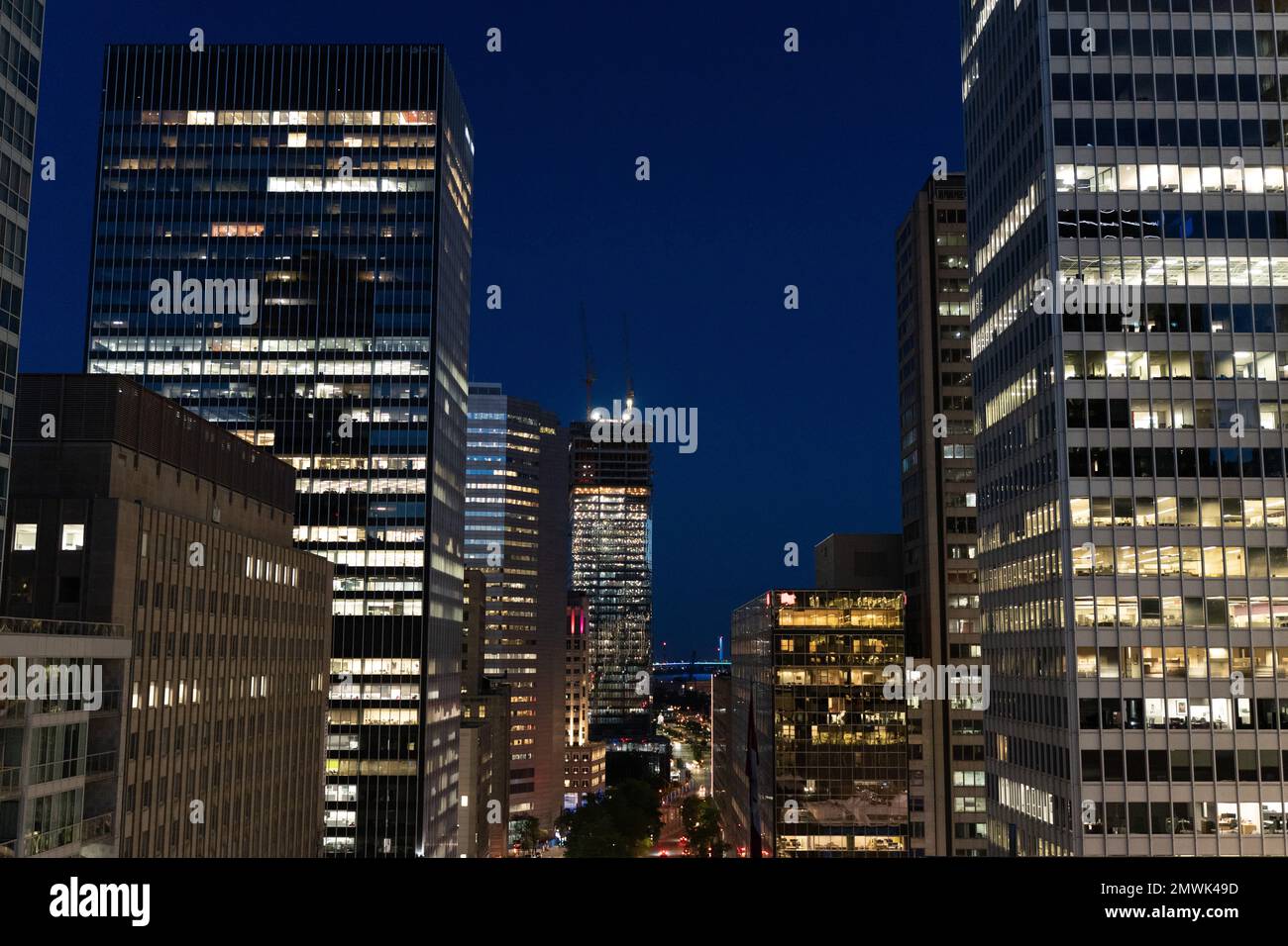 The beautiful illuminated skyscrapers with the dark blue nighttime sky ...