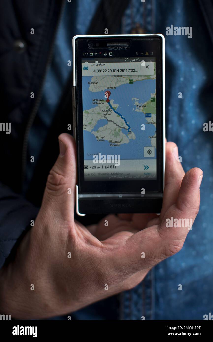 In this Friday, Oct. 2, 2015 photo, a Syrian refugee shows his phone ...