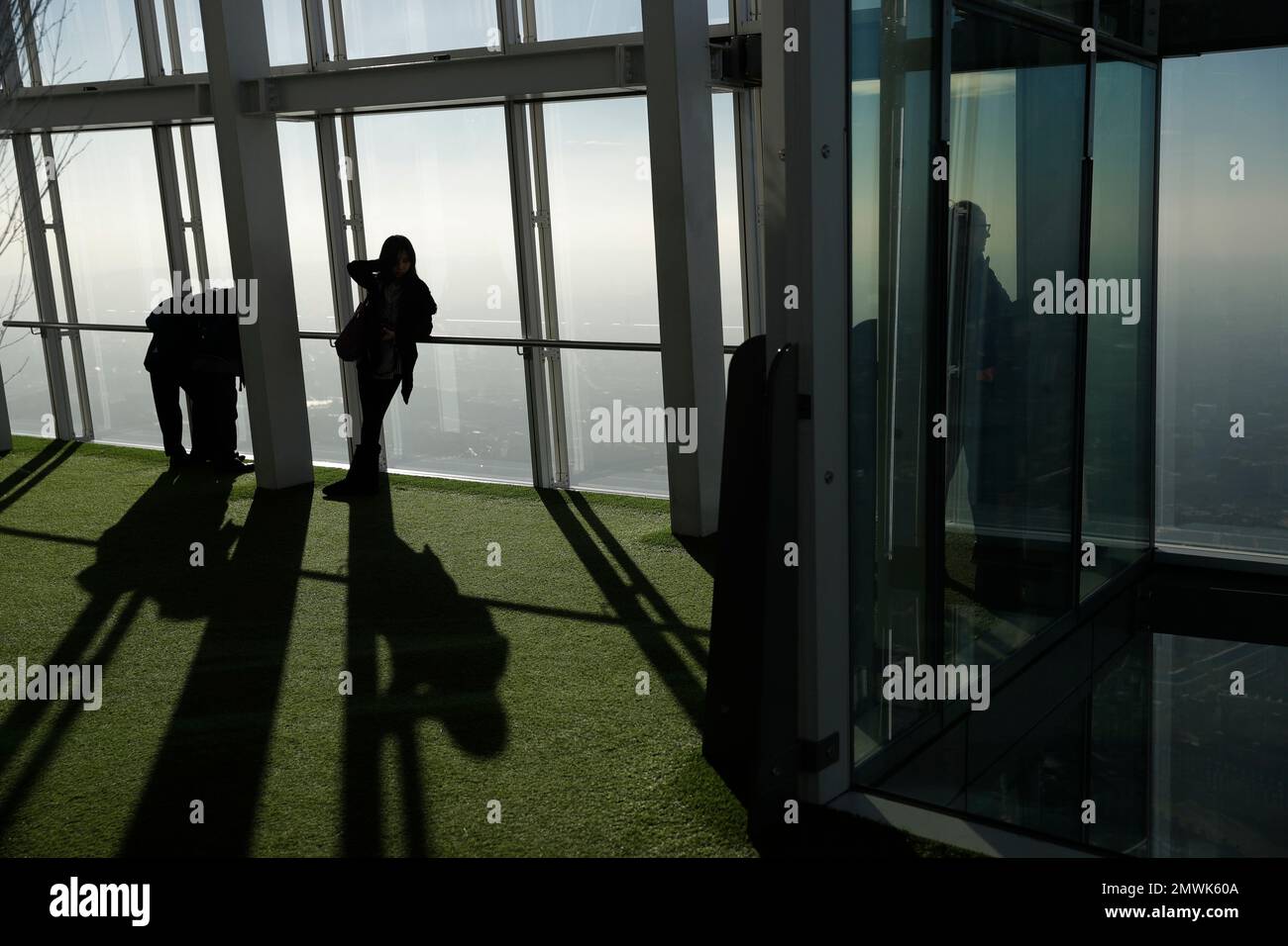 People look out from a viewing area of the 95-storey skyscraper The ...