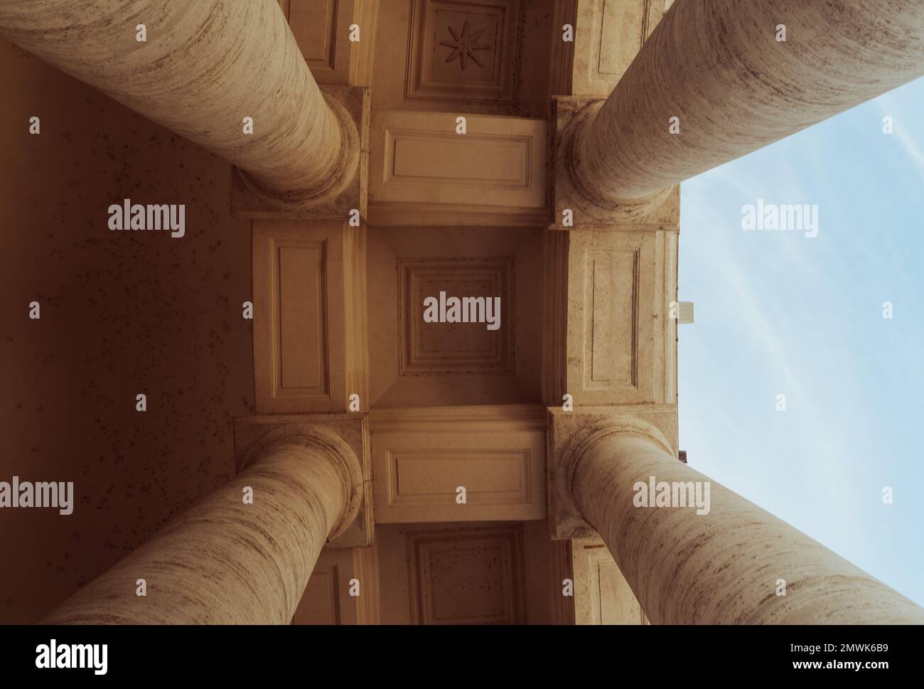 A low-angle shot of columns of an aged building Stock Photo - Alamy