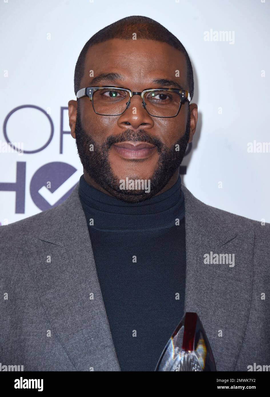 Tyler Perry poses in the press room with the award for favorite ...