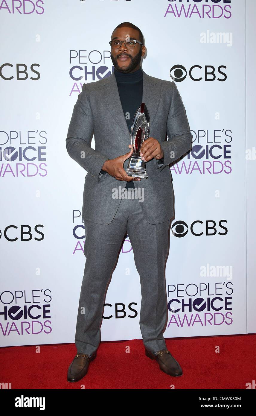Tyler Perry poses in the press room with the award for favorite ...