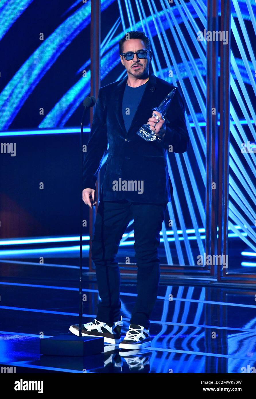 Robert Downey Jr. accepts the award for favorite action movie actor at ...