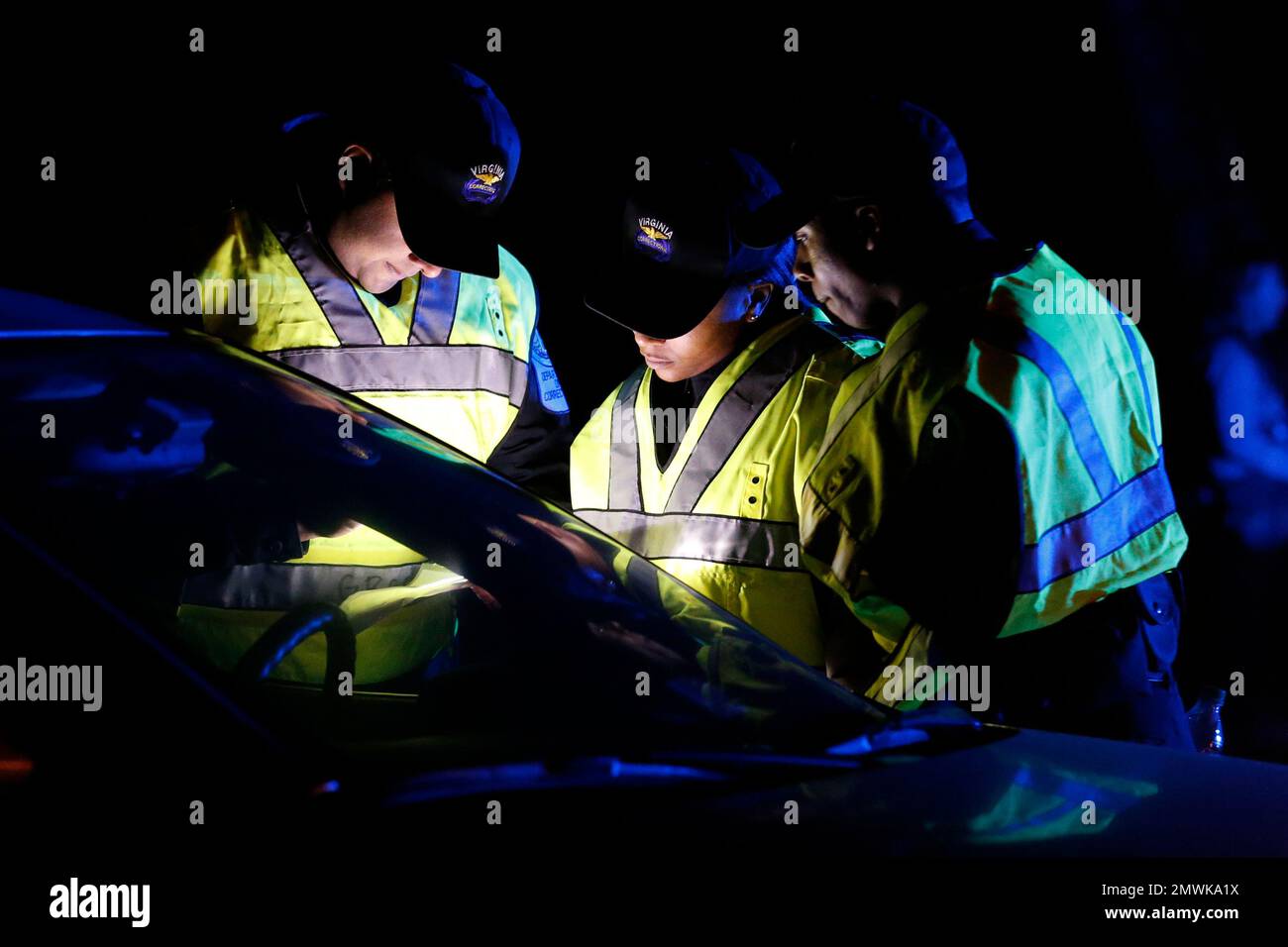 Virginia Department of Correction officers check identifications ...