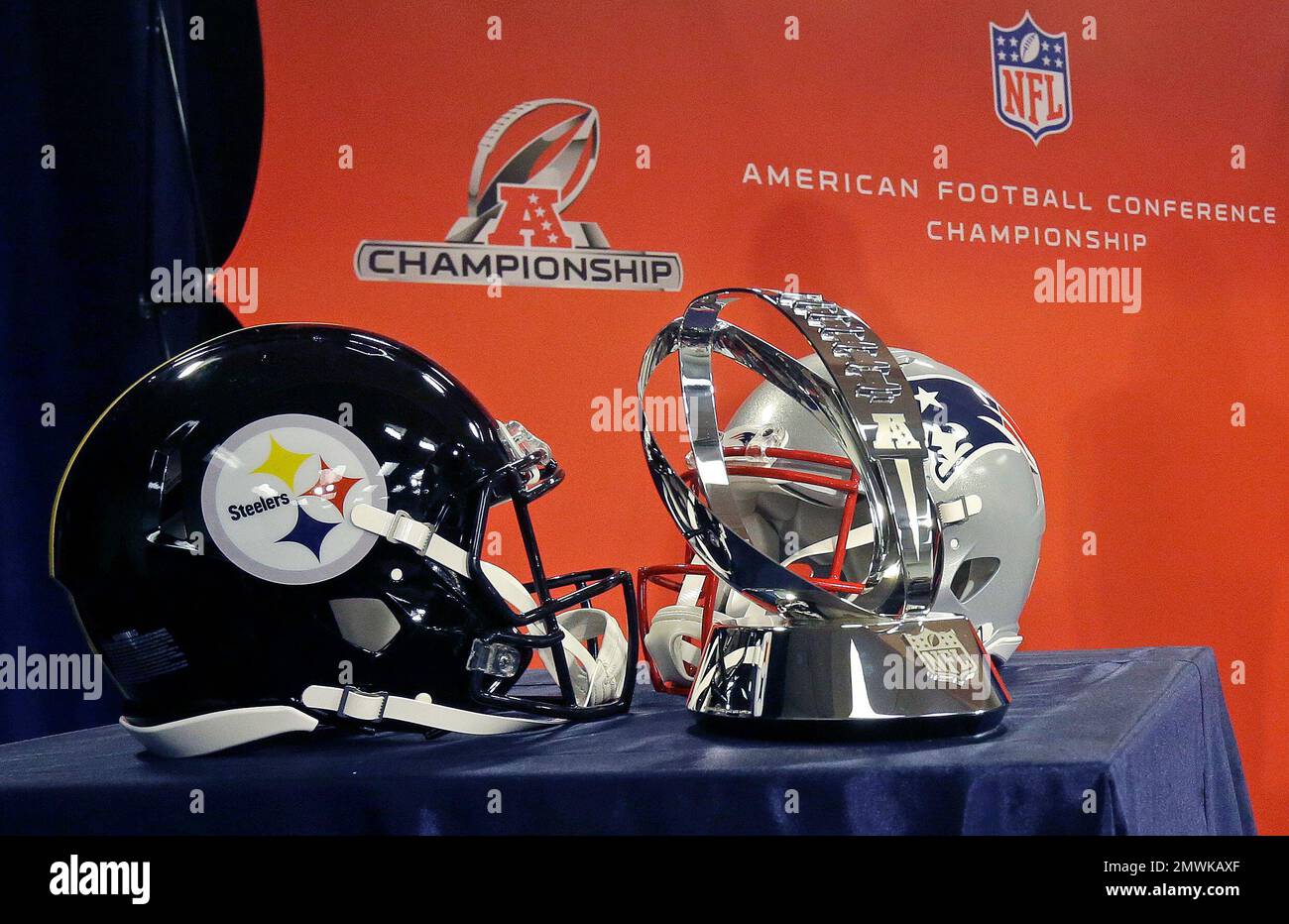 The AFC championship trophy and helmets from the Steelers and Patriots ...
