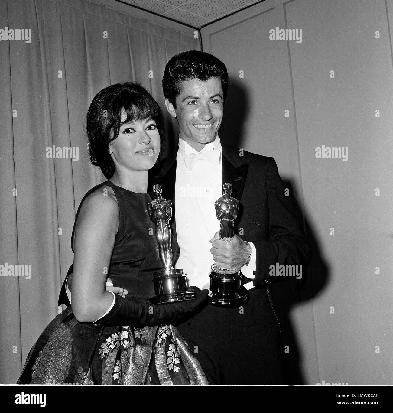 Rita Moreno and George Chakiris pose with their Oscars after they each ...
