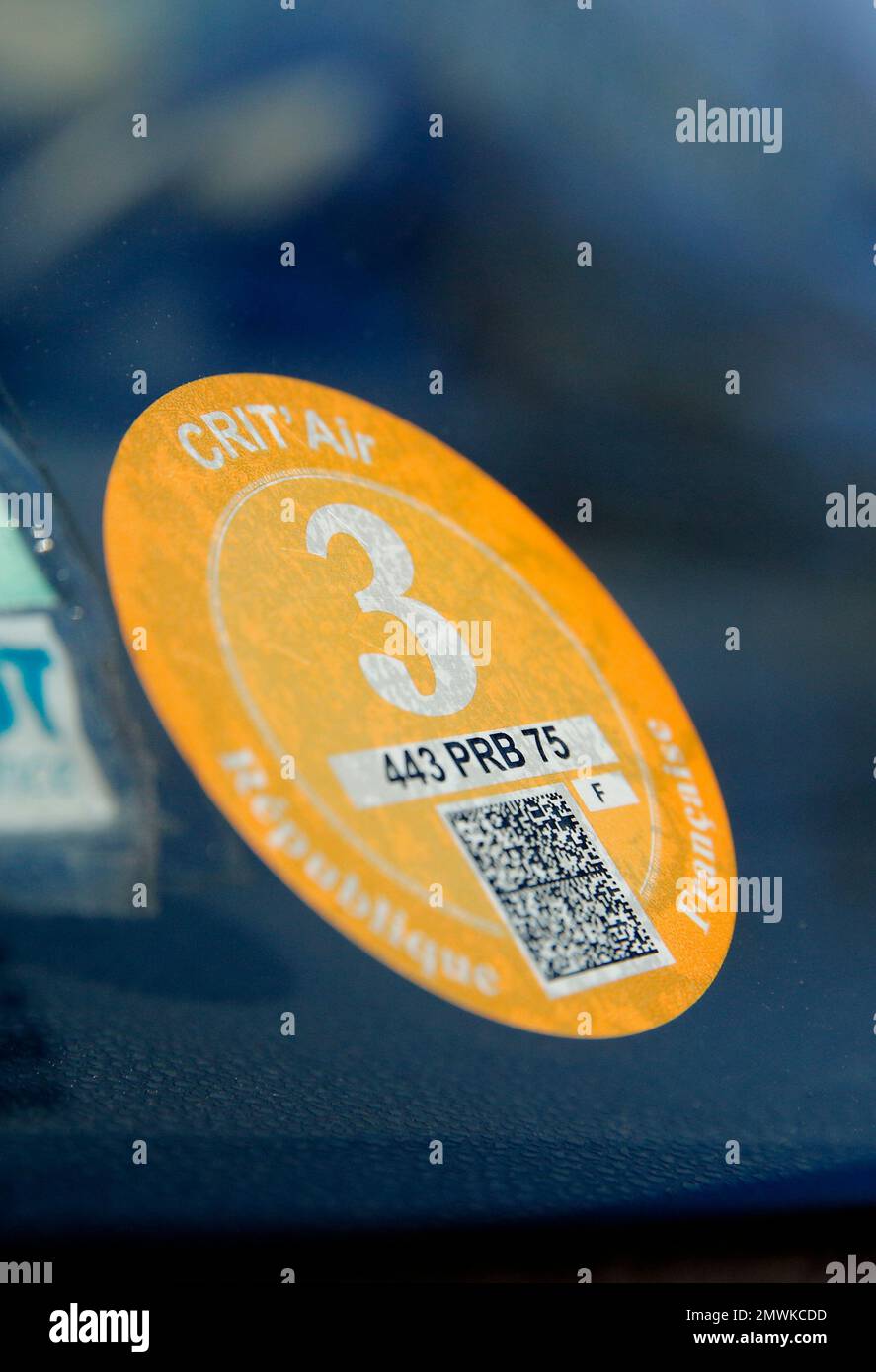 A "Crit'Air" (air criteria) sticker is pictured on a windscreen in ...