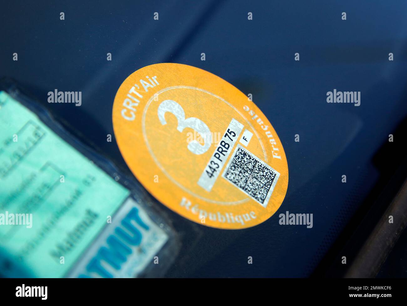 A "Crit'Air" (air criteria) sticker is pictured on a windscreen in ...