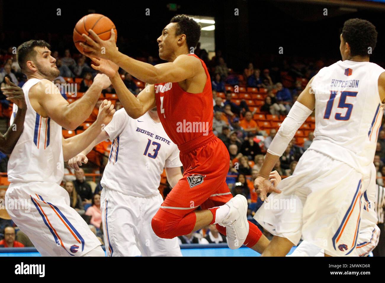 New Mexico's Elijah Brown goes to the basket past Boise State's Zach ...