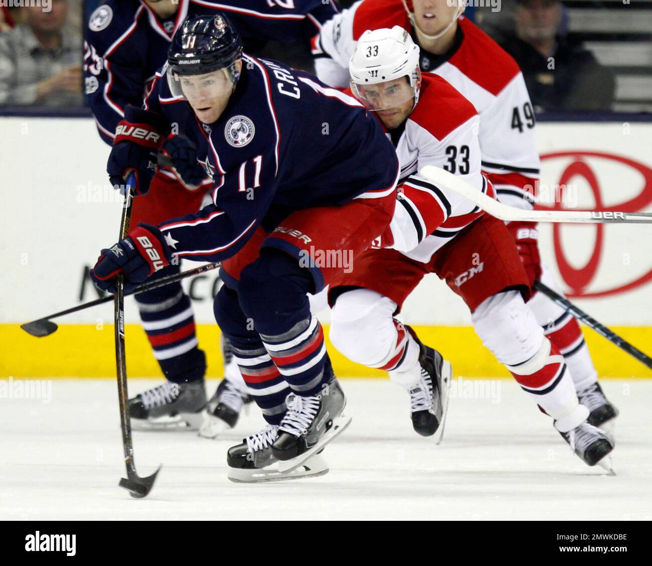 Columbus Blue Jackets forward Matt Calvert, left, works against ...