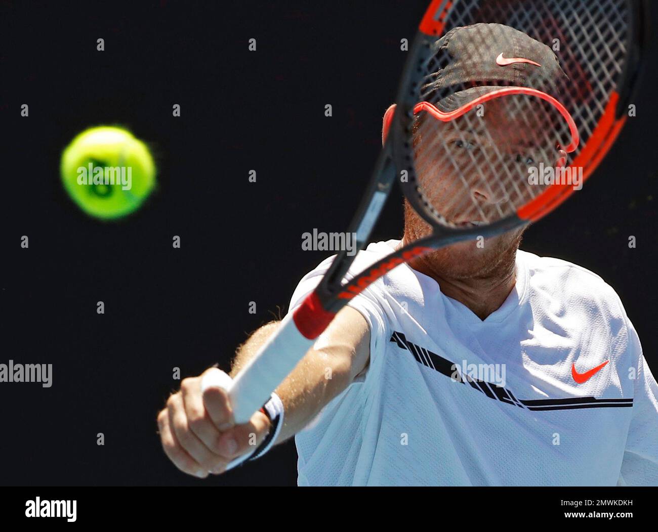 Israel's Dudi Sela makes a backhand return to Slovakia's Lukas Lacko ...