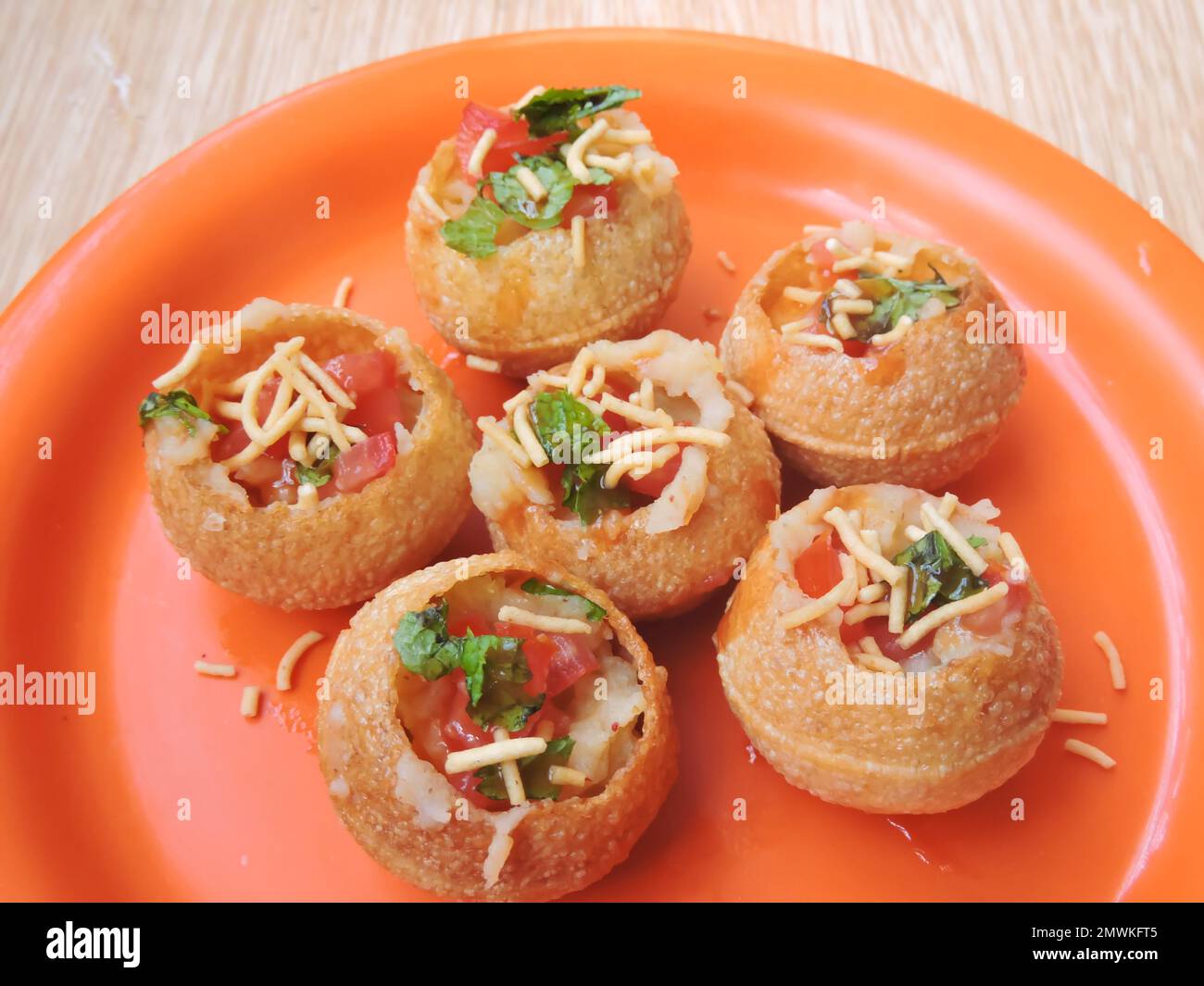 It consists of a round or ball-shaped, hollow deep-fried crisp filled ...