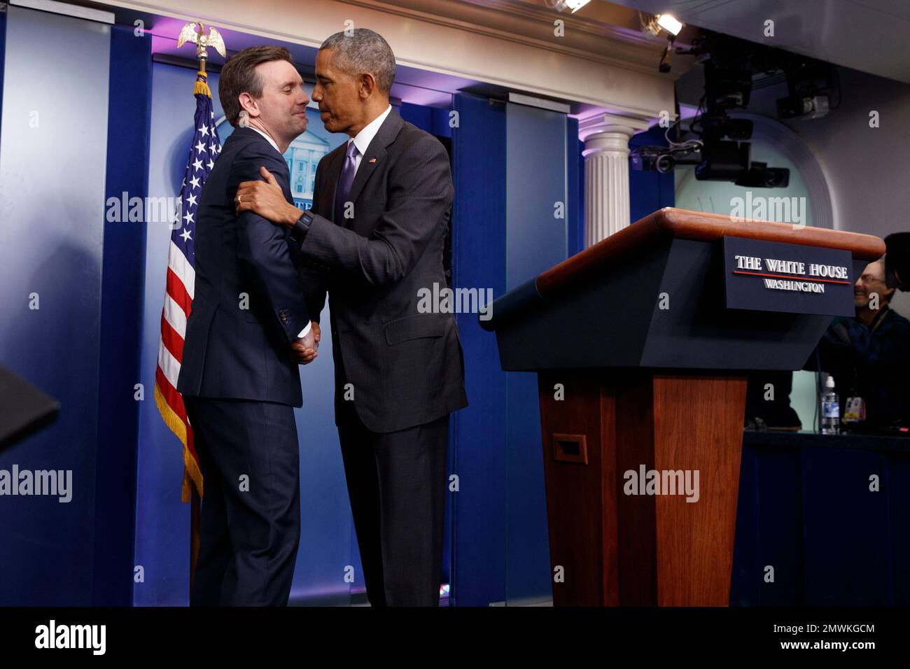 President Barack Obama hugs White House press secretary Josh Earnest ...
