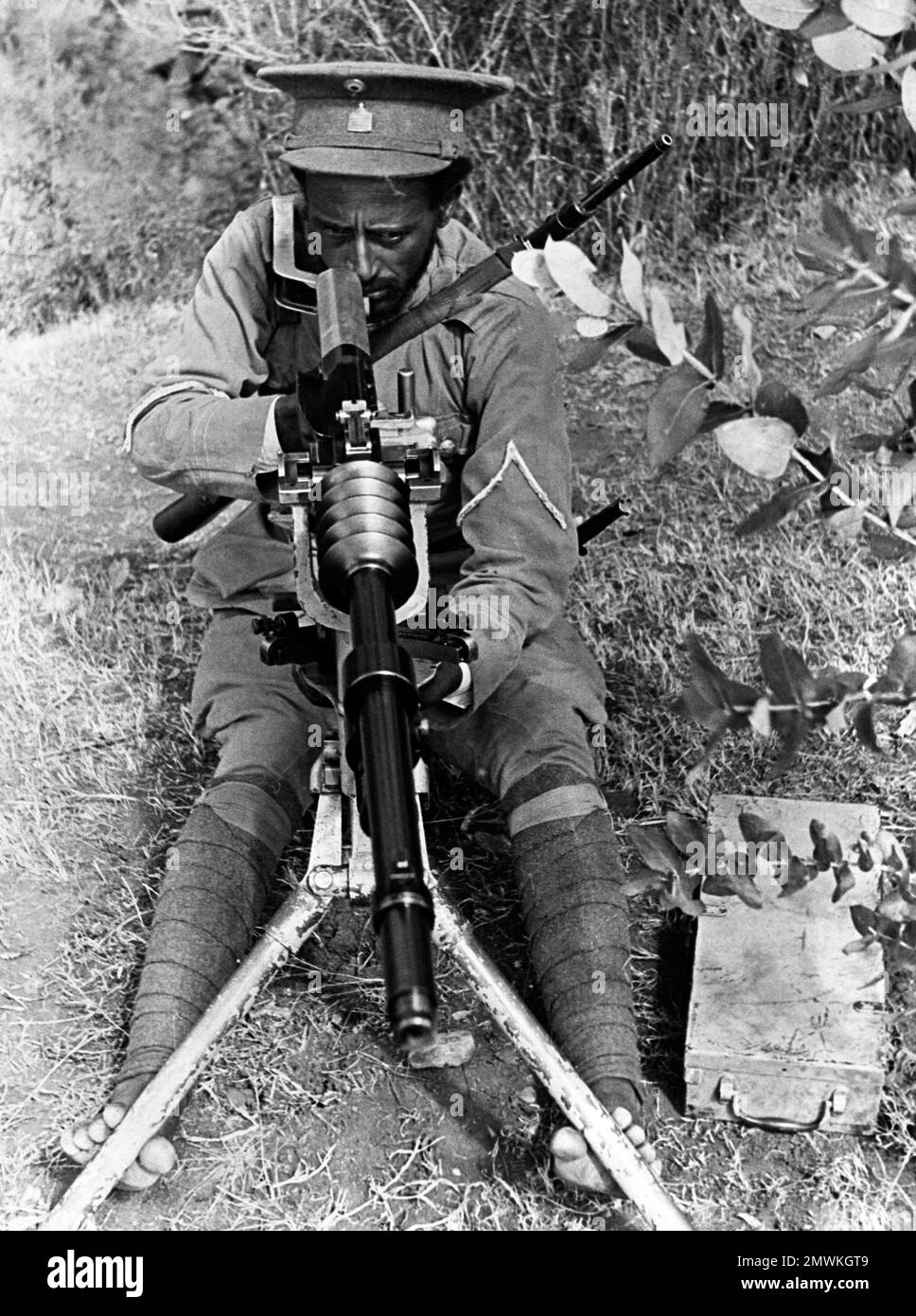An Abyssinian machine-gunner in action during recent maneuvers in Addis ...