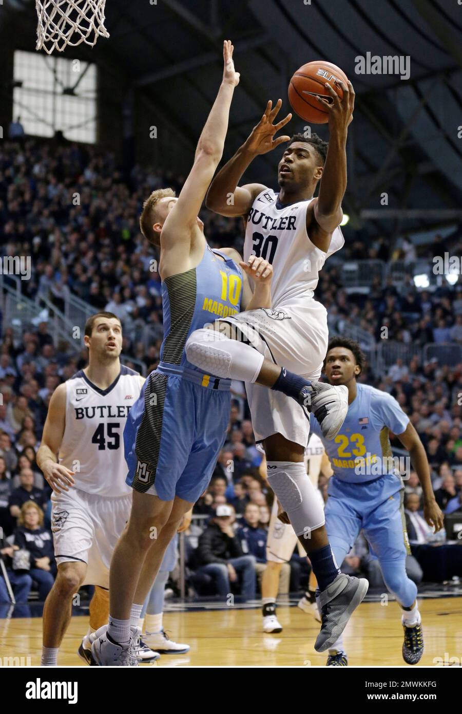 Butler forward Kelan Martin (30) shoots over Marquette guard Sam Hauser ...