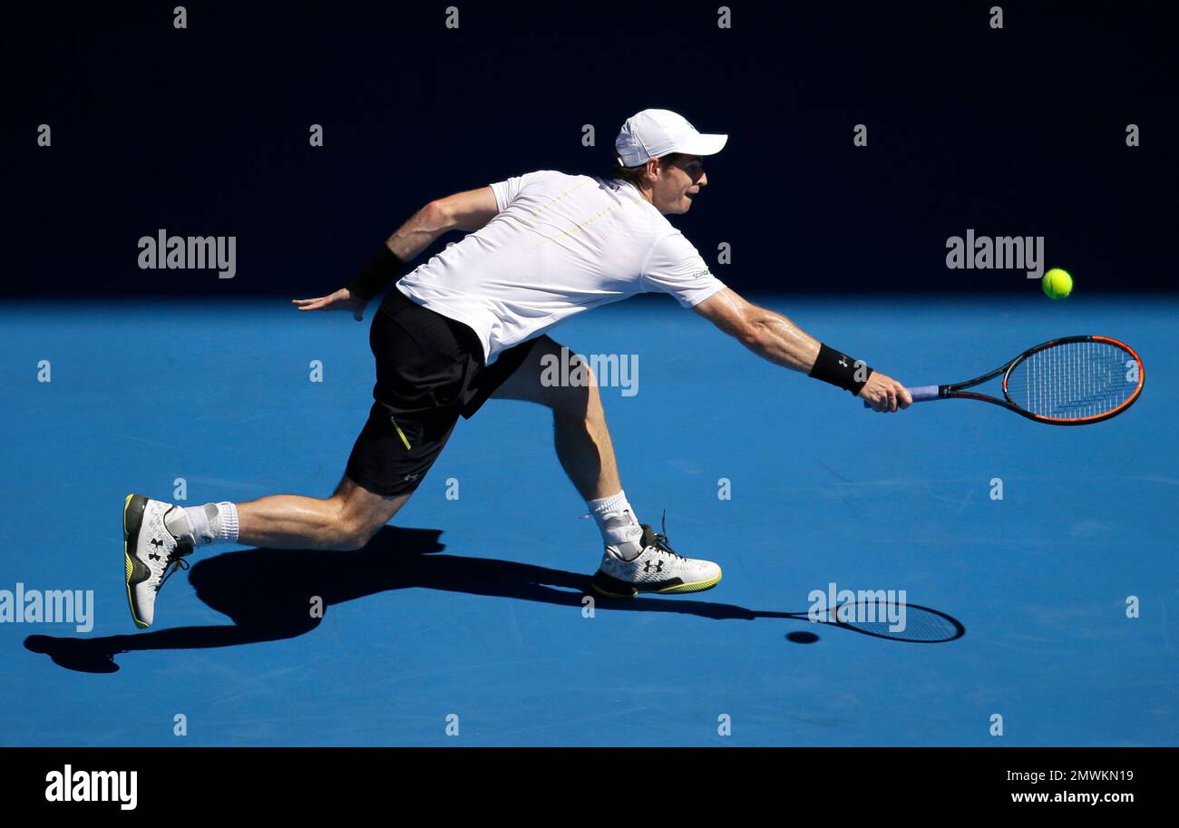 Britain's Andy Murray hits a backhand return to Ukraine's Illya ...