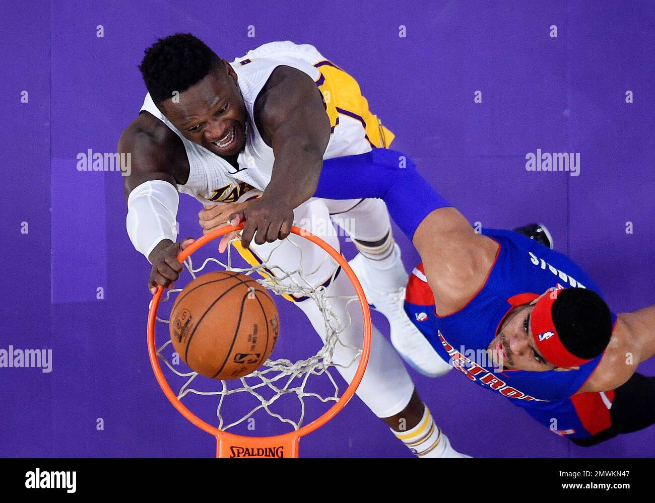 Los Angeles Lakers forward Julius Randle, left, dunks as Detroit ...