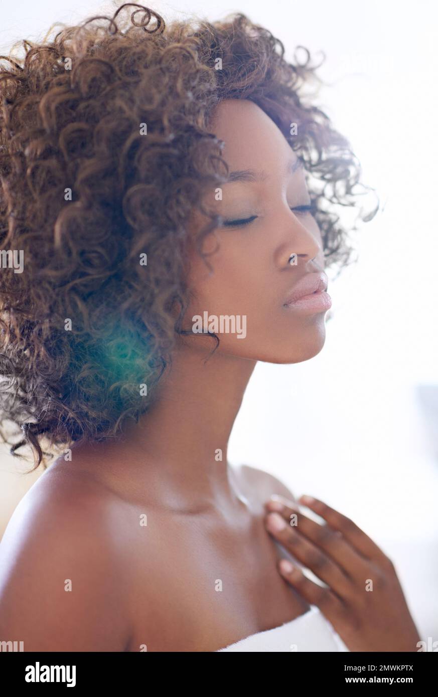 Morning serenity. a beautiful young woman during her daily beauty ...