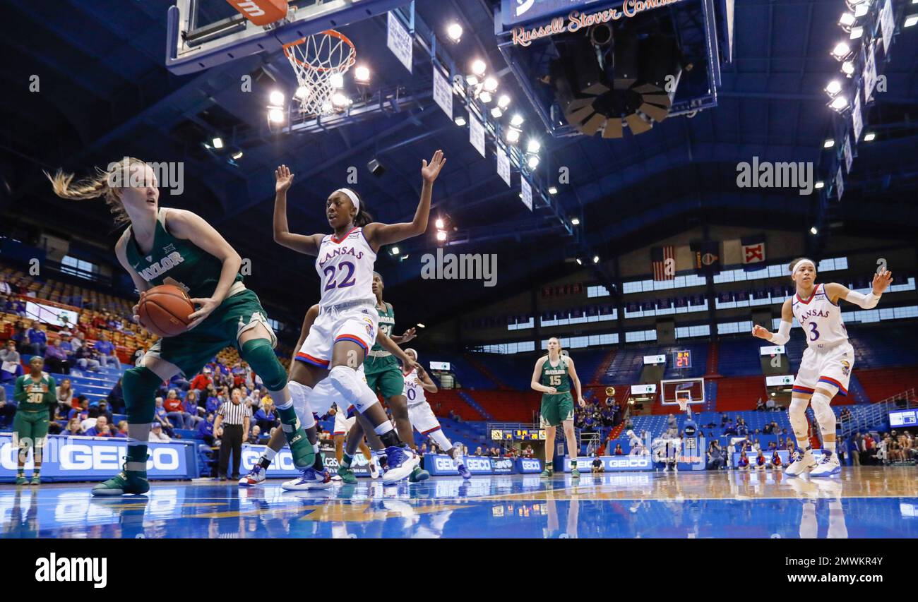 Baylor guard Kristy Wallace, left, prepares to pass defended by Kansas ...