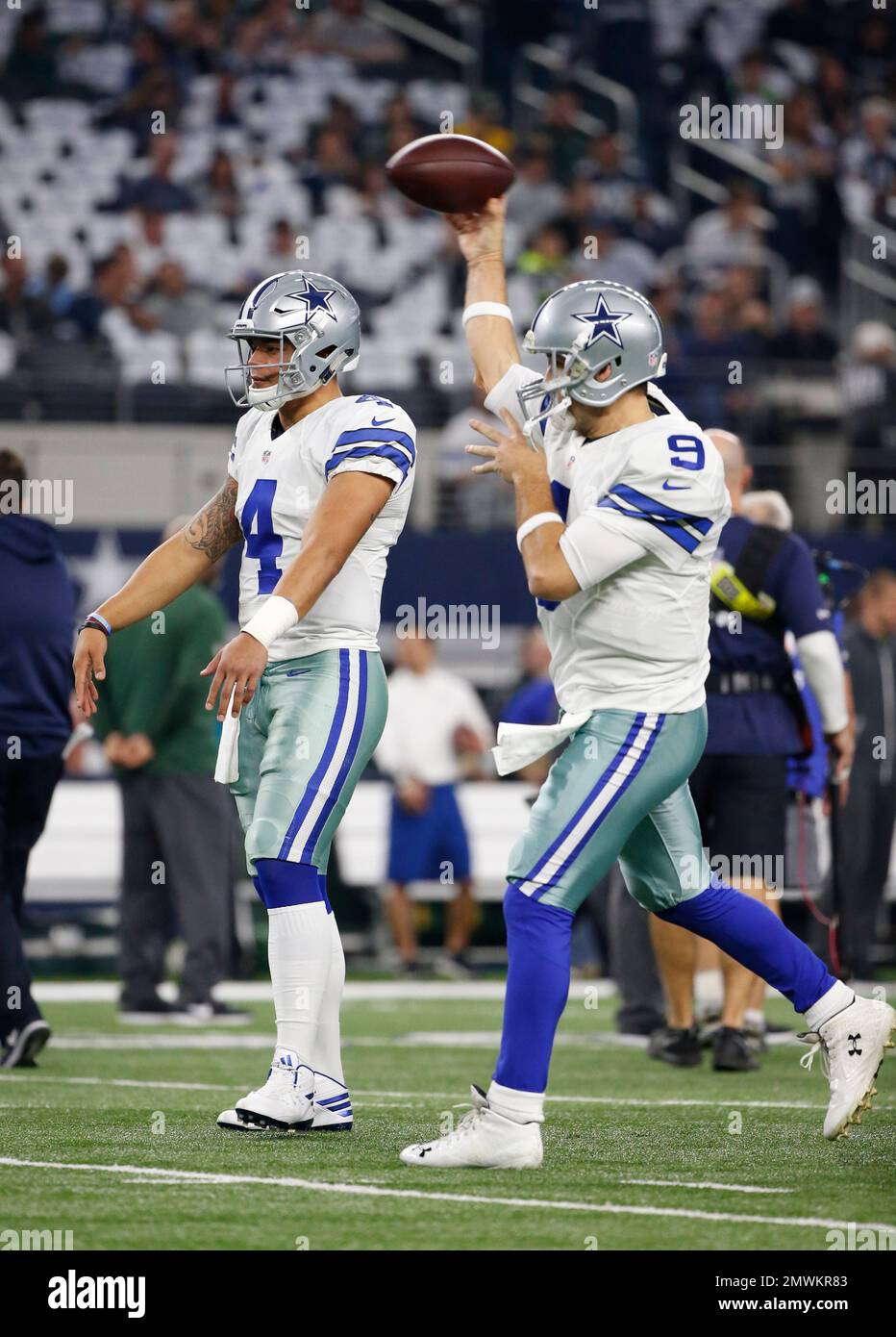 Dallas Cowboys' Tony Romo talks to Dak Prescott before an NFL ...