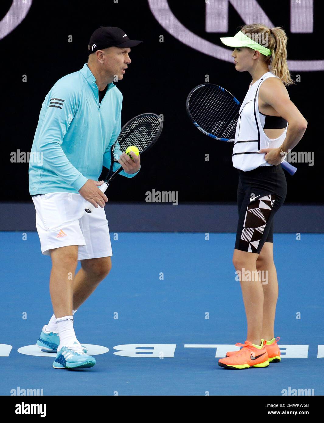 Canada's Eugenie Bouchard, right, listens to her coach Thomas Hogstedt ...