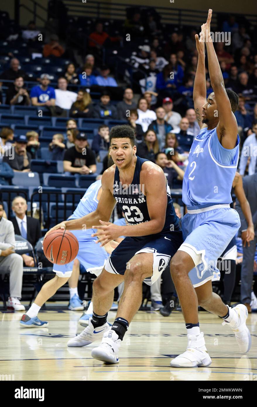 BYU forward Yoeli Childs (23) drives past San Diego guard Mark Carbone ...