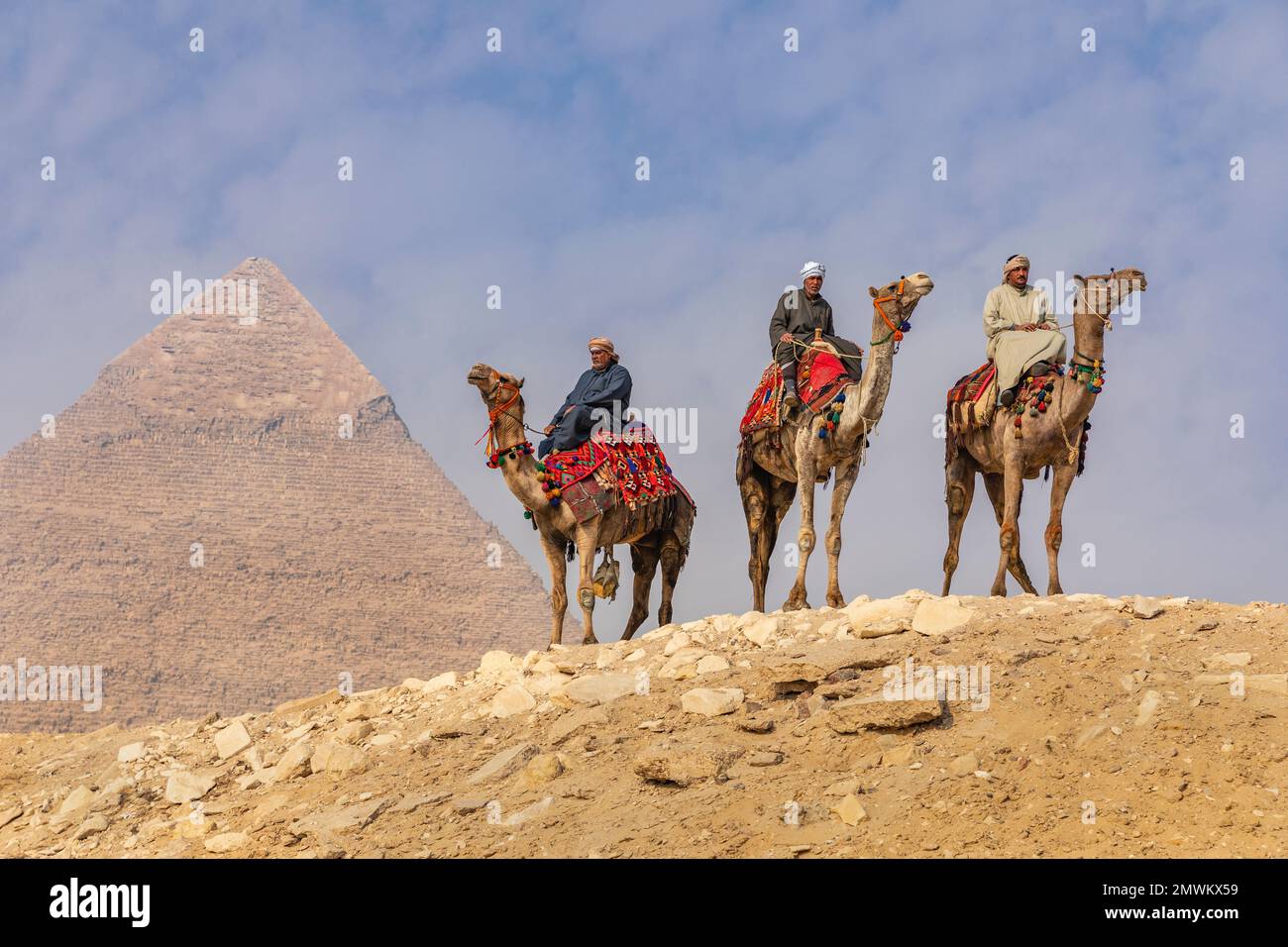 Egyptian men on camels at the Pyramid of Khafre, Cairo, Egypt Stock ...