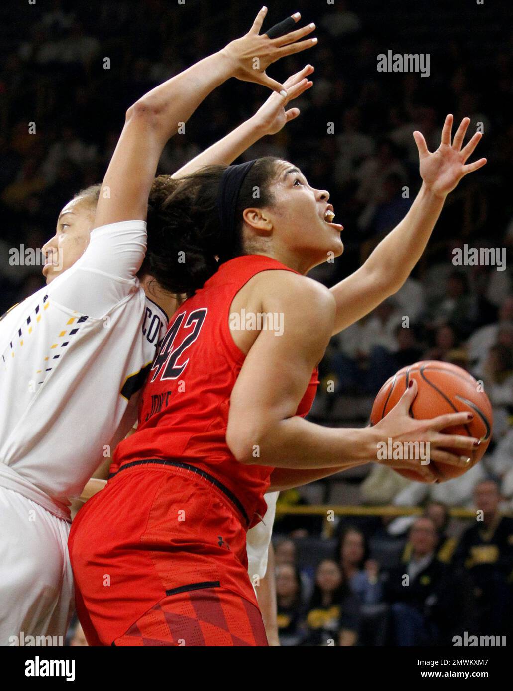 Maryland's Brionna Jones (42) goes to the basket against Iowa's Chase ...
