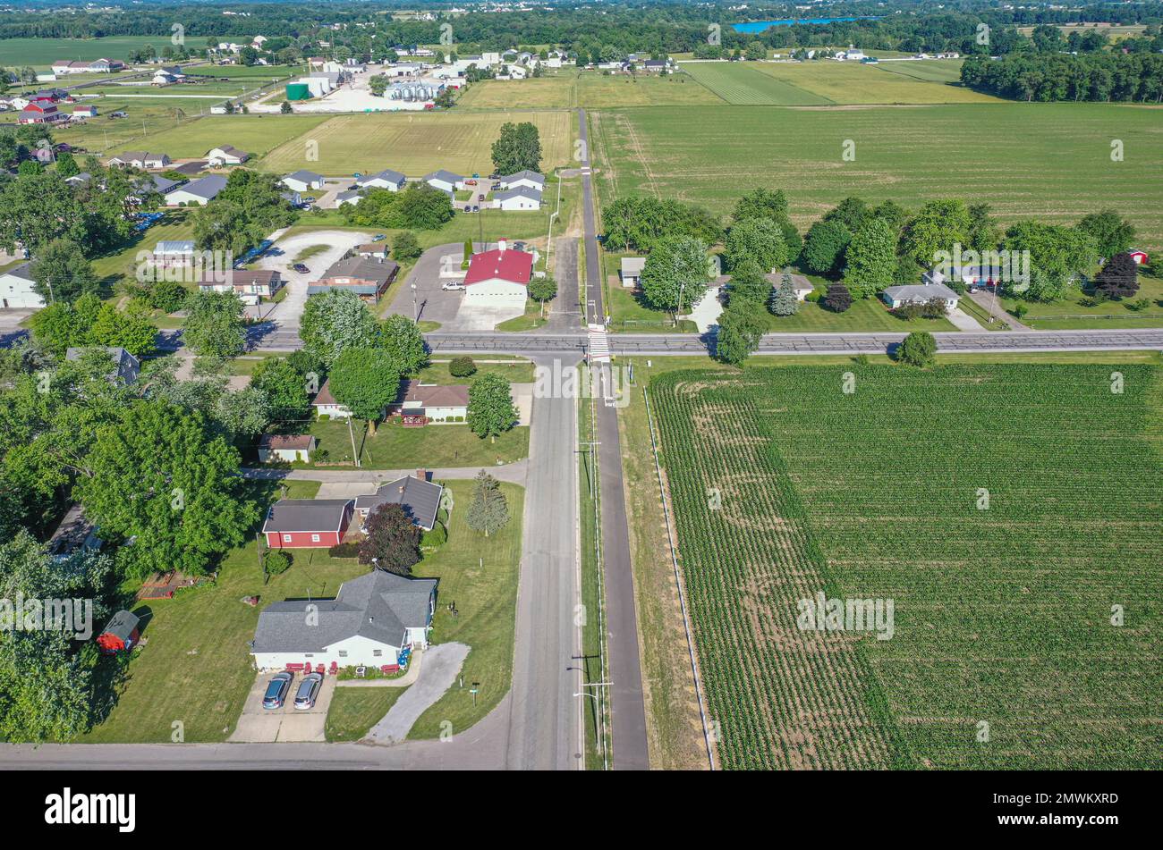 An aerial view of a town with green fields Stock Photo - Alamy