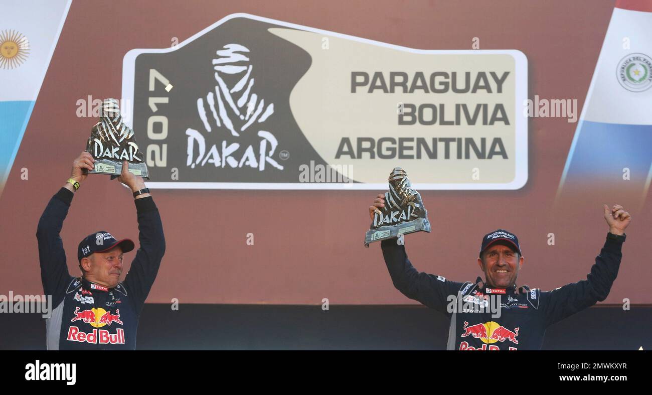 Peugeot's driver Stephane Peterhansel, right, and co-driver Jean Paul ...
