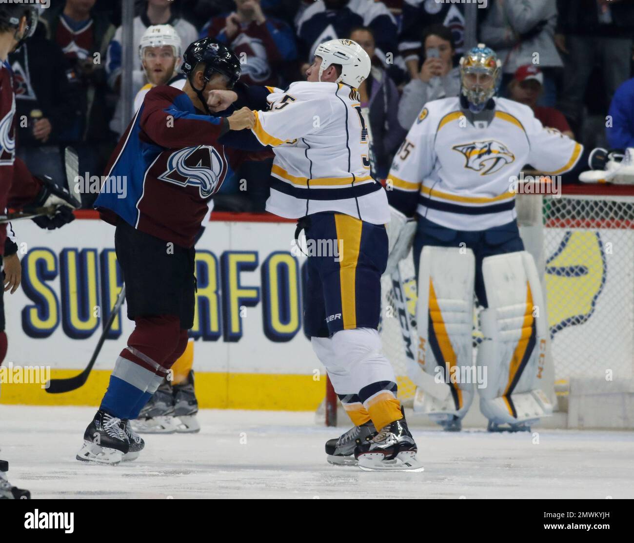 Nashville Predators left wing Cody McLeod, right, lands a punch on the ...