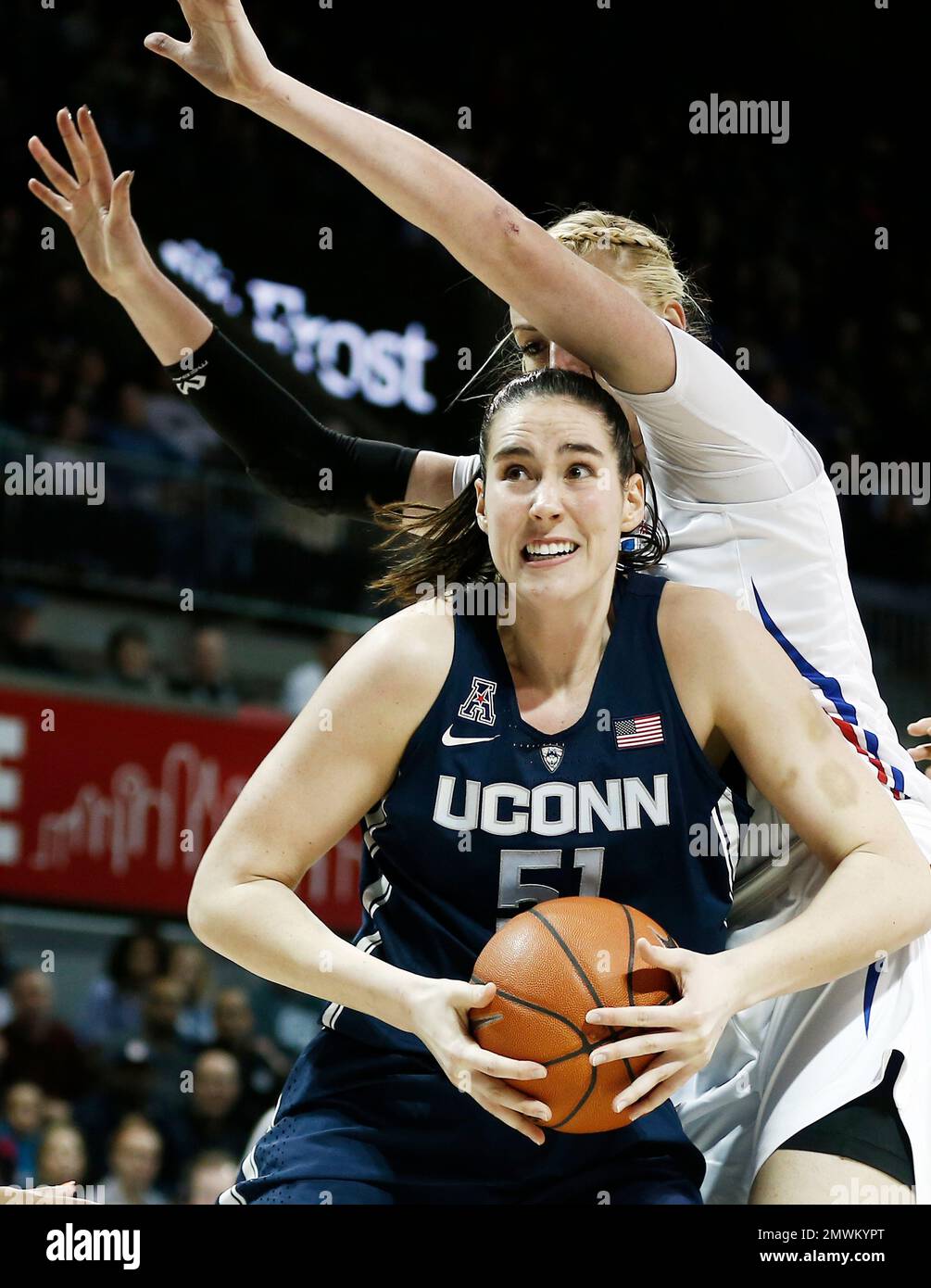 Connecticut forward Natalie Butler (51) battles SMU forward Klara ...