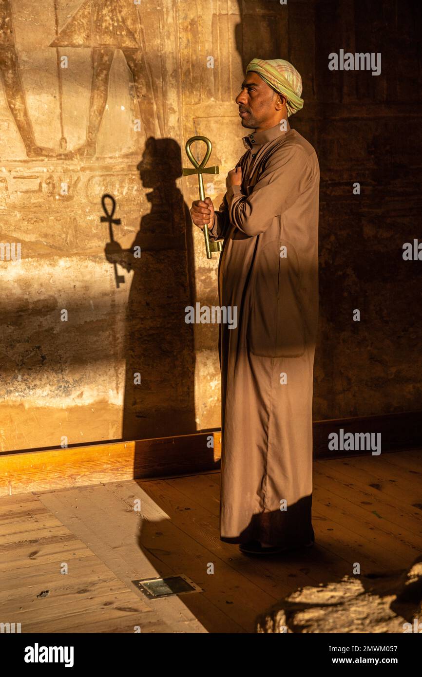 Doorkeeper holding Ankh, the key of life, during sunrise at the Great ...