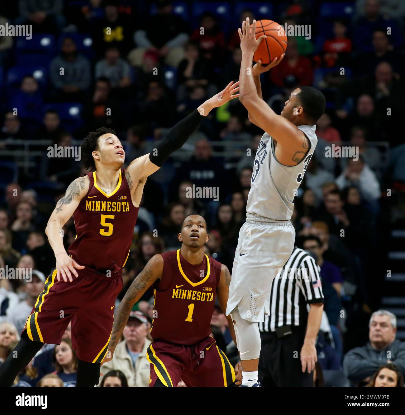 Penn State's Shep Garner (33) puts up a shot as Minnesota's Amir Coffey ...