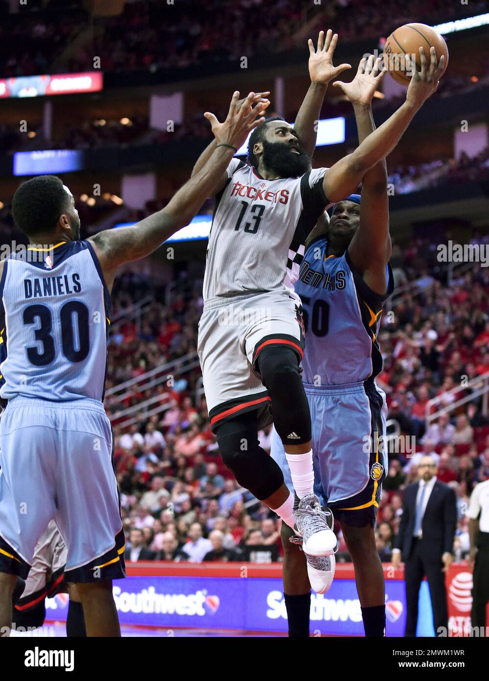 Houston Rockets guard James Harden (13) drives to the basket as Memphis ...