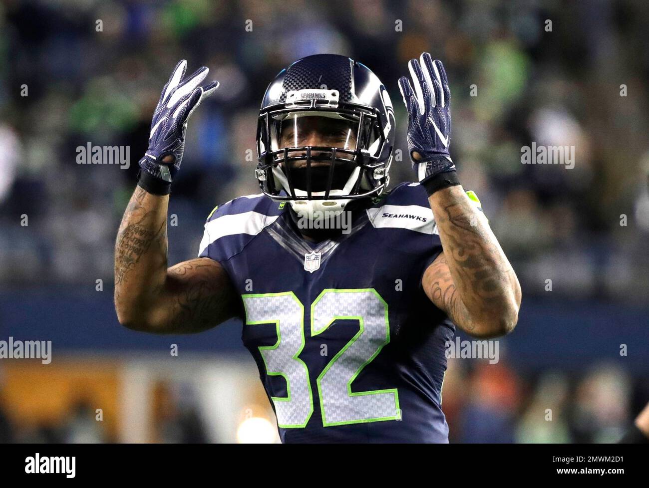 Seattle Seahawks defensive back Jeron Johnson tries to rally the crowd ...