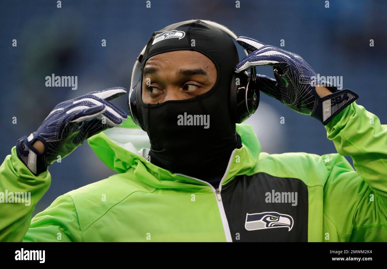 Seattle Seahawks defensive back Jeron Johnson wears headphones and a ...