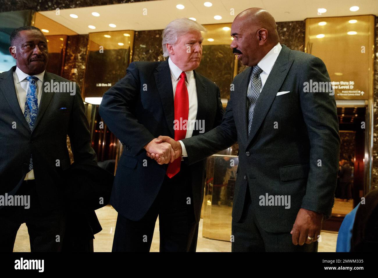 President-elect Donald Trump shakes hands with comedian Steve Harvey in ...