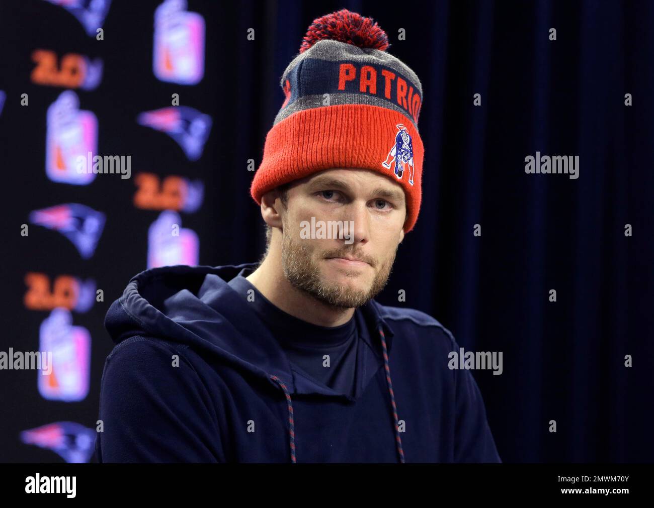 New England Patriots quarterback Tom Brady faces reporters following an ...