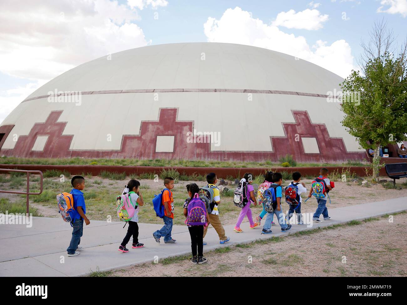 FILE - In this Sept. 25, 2014 file photo, students walk between ...