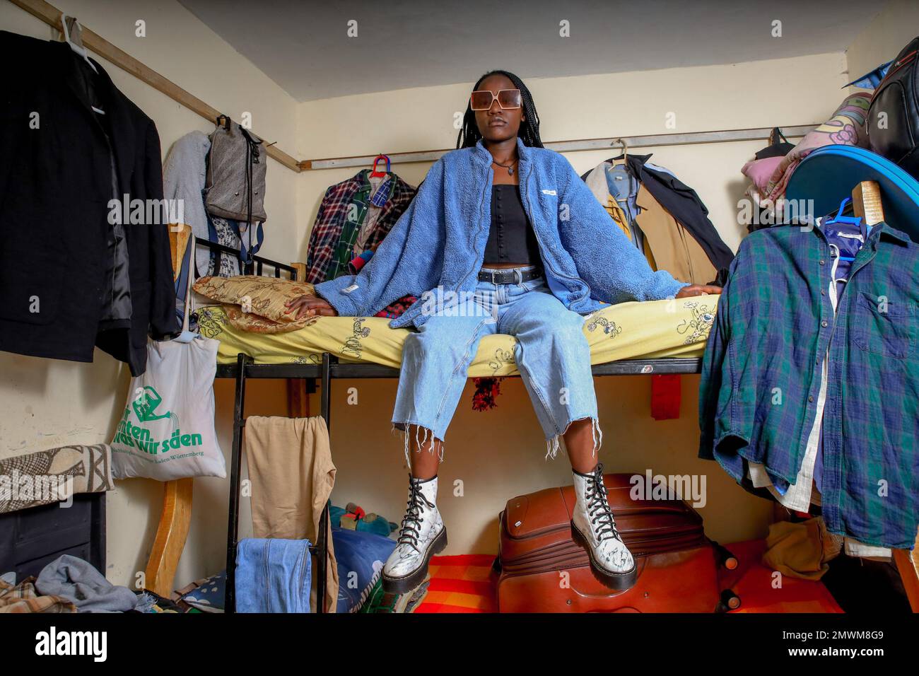 20-Year-Old Cynthia Gesare poses on her bed inside her little room ...