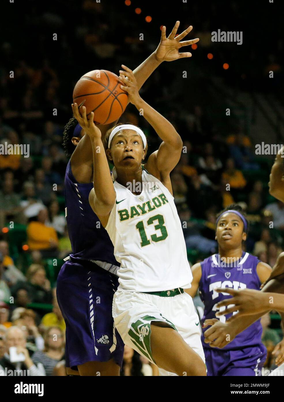 Baylor's Nina Davis (13) goes up for a shot after getting past TCU's ...