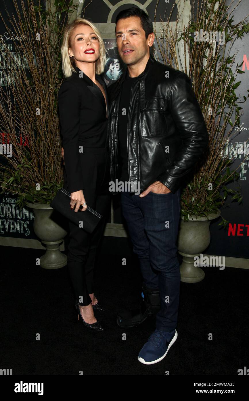 Kelly Ripa, left, and Mark Consuelos, right, attend the world premiere ...