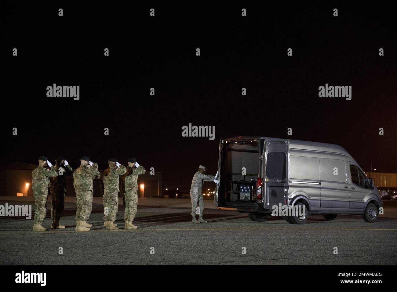 An Army carry team salutes as Airman 1st Class Emmanuel Yeboah closes ...
