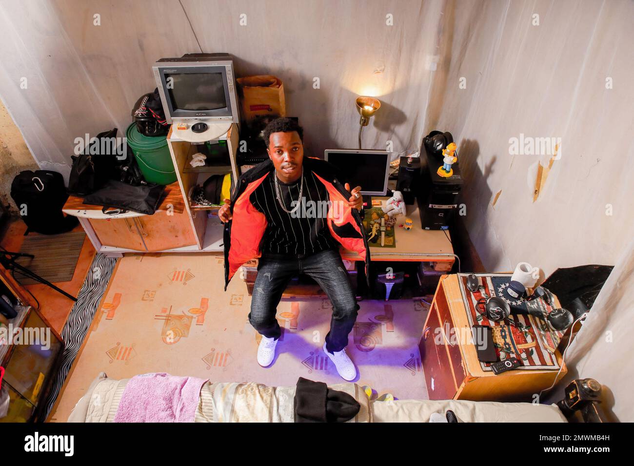 22-Year-Old Brian Thomas dressed in his nice attire poses inside his ...