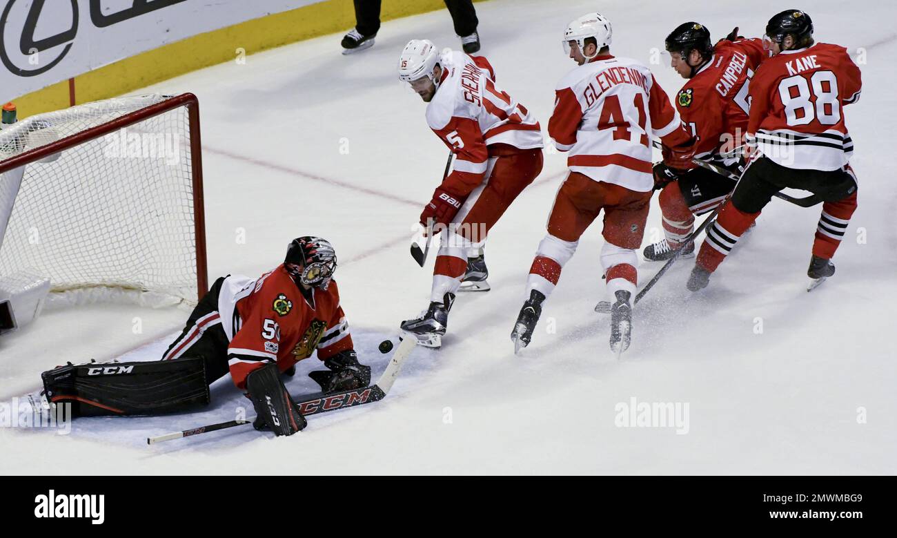 Chicago Blackhawks goalie Corey Crawford (50) fights for the puck ...